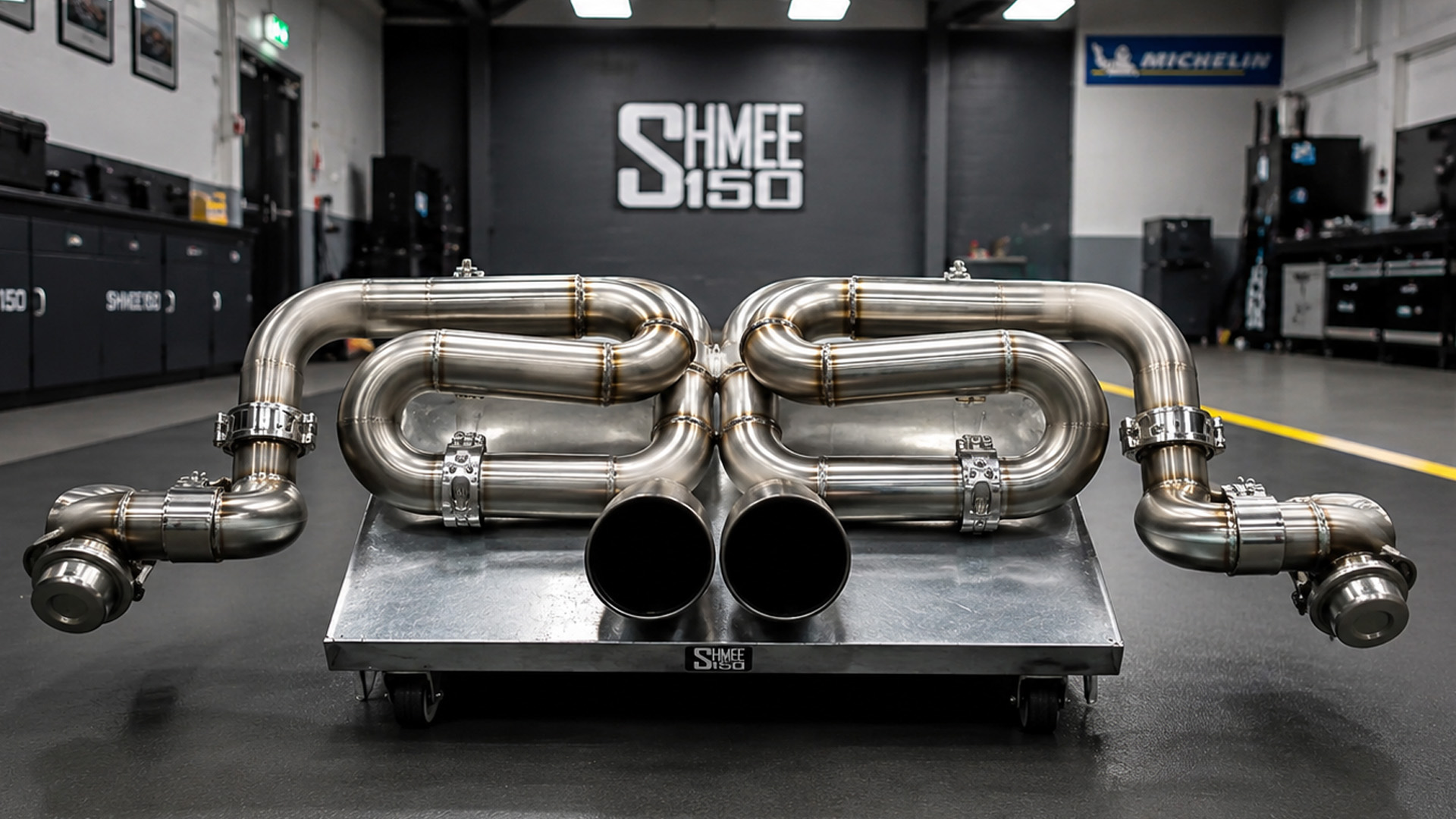 Titanium valved exhaust system displayed in Shmee150 garage