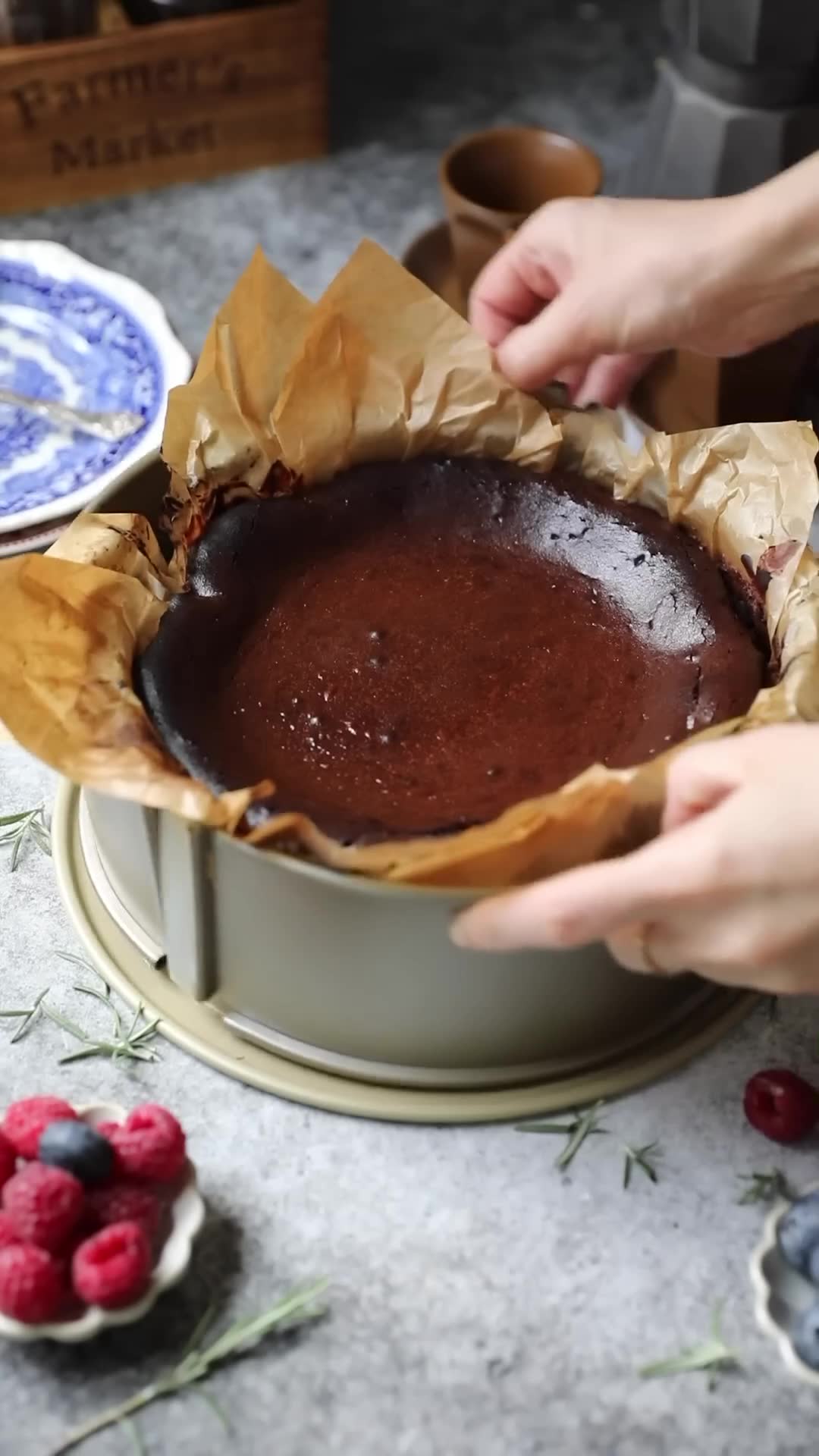 Two creamy Basque-style cheesecakes in pistachio and chocolate