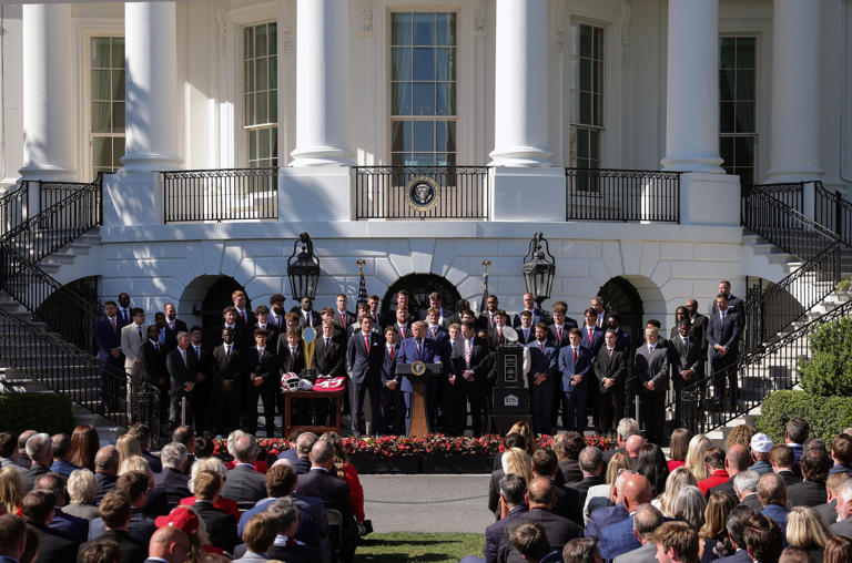 Trump, 79, struggles to find star coach standing next to him