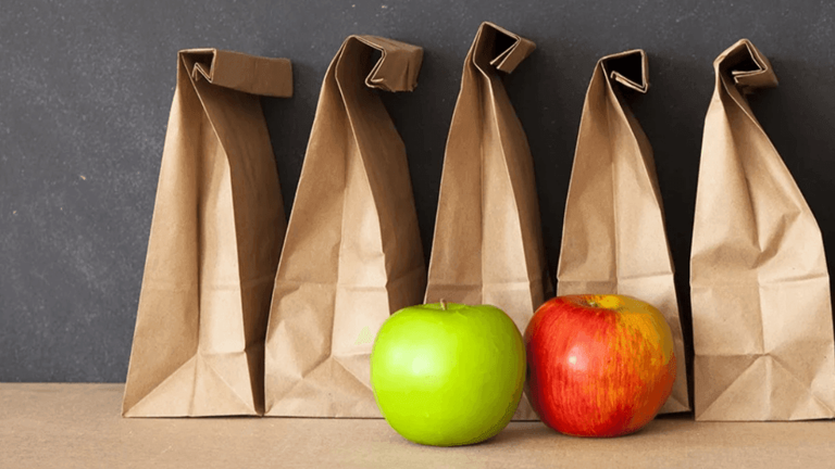 CHEW officials dish up thanks as volunteers pack meals for Onslow students