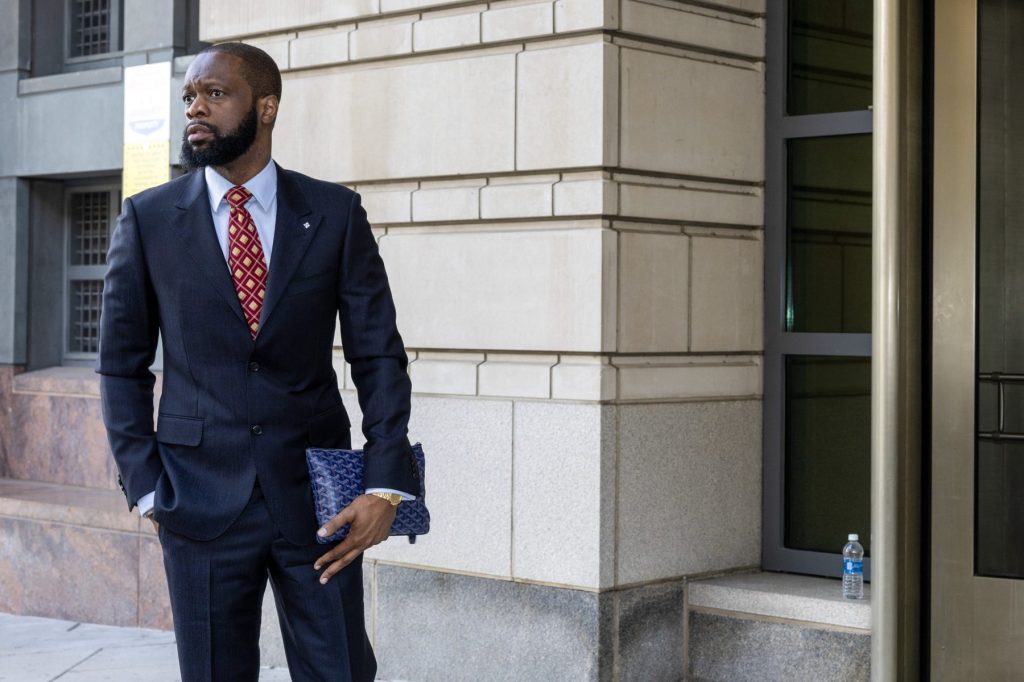 Fugees' Pras Michel surrenders to begin 14-year prison sentence