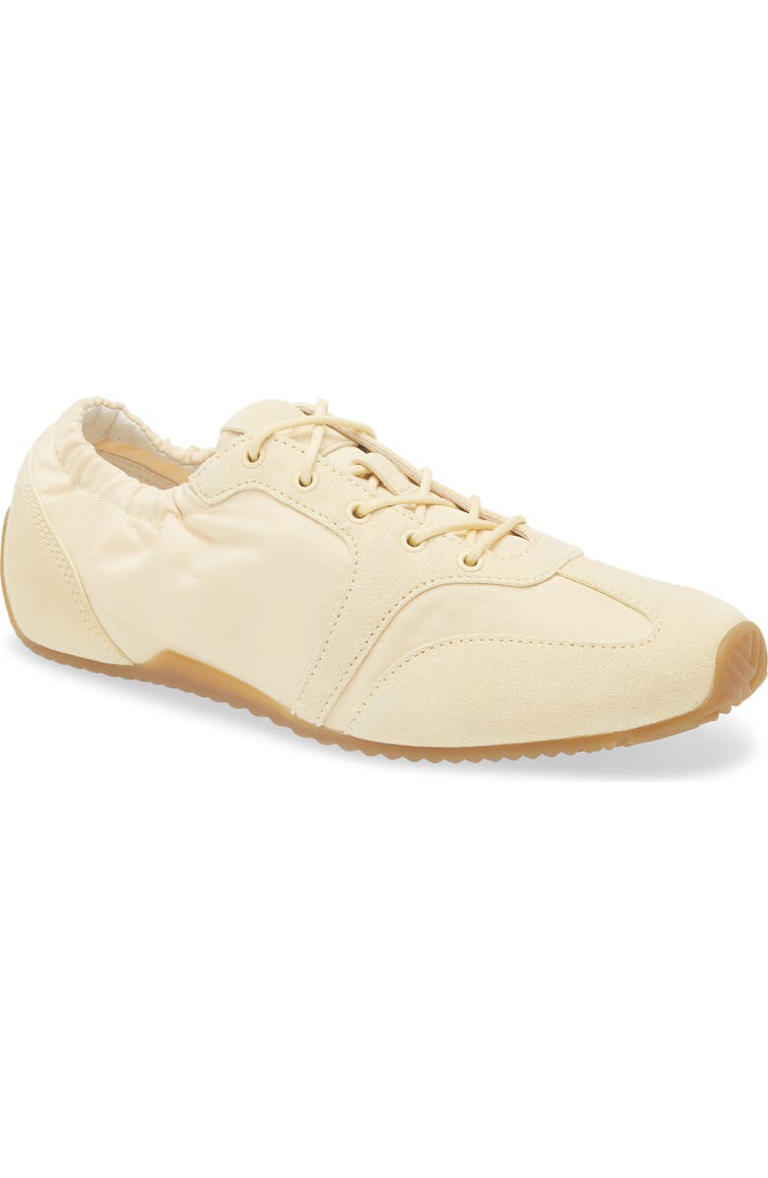 The coolest sneaker color trend to wear with black pants in 2026 is here