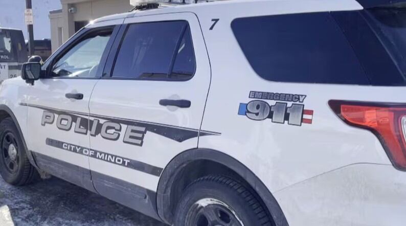 Minot police officer struck by vehicle during response to call