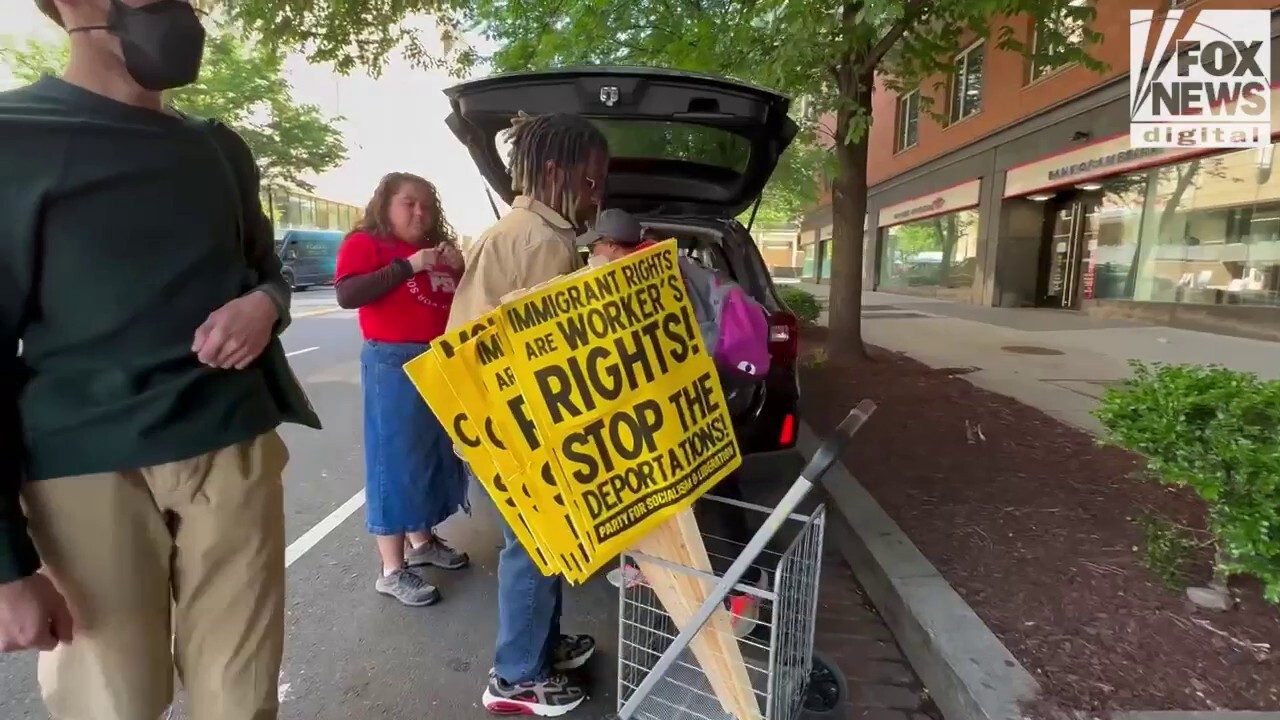 Pro-socialism activists unload supplies ahead of May Day demonstrations ...