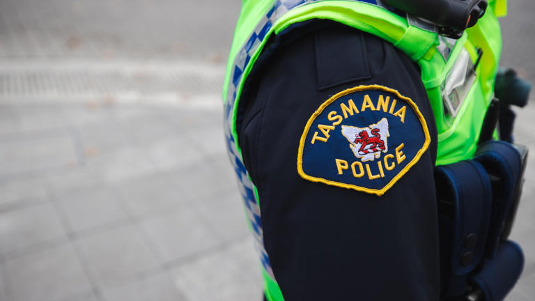 Woman struck man with car 'at speed' in Hobart frontyard, police say
