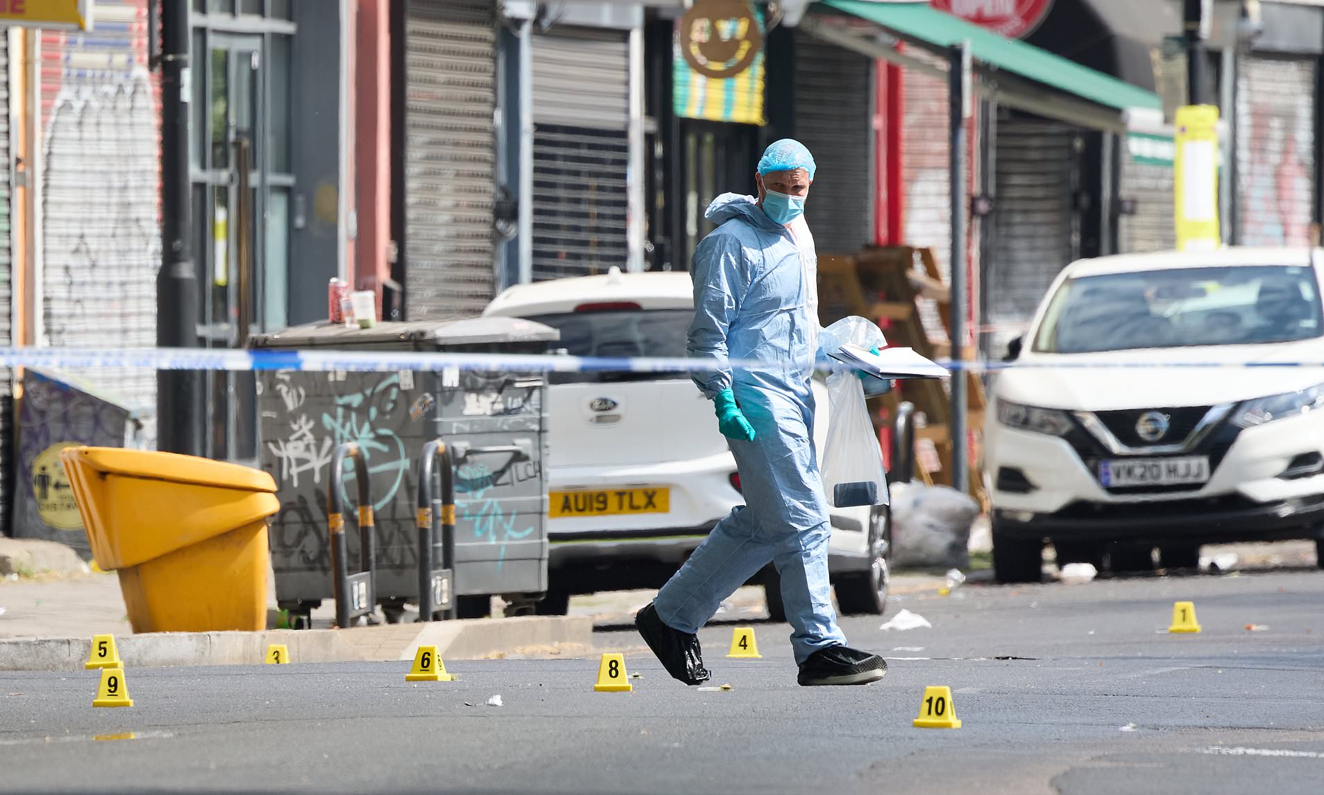 Street shooting puts four in hospital with one fighting for life after ...