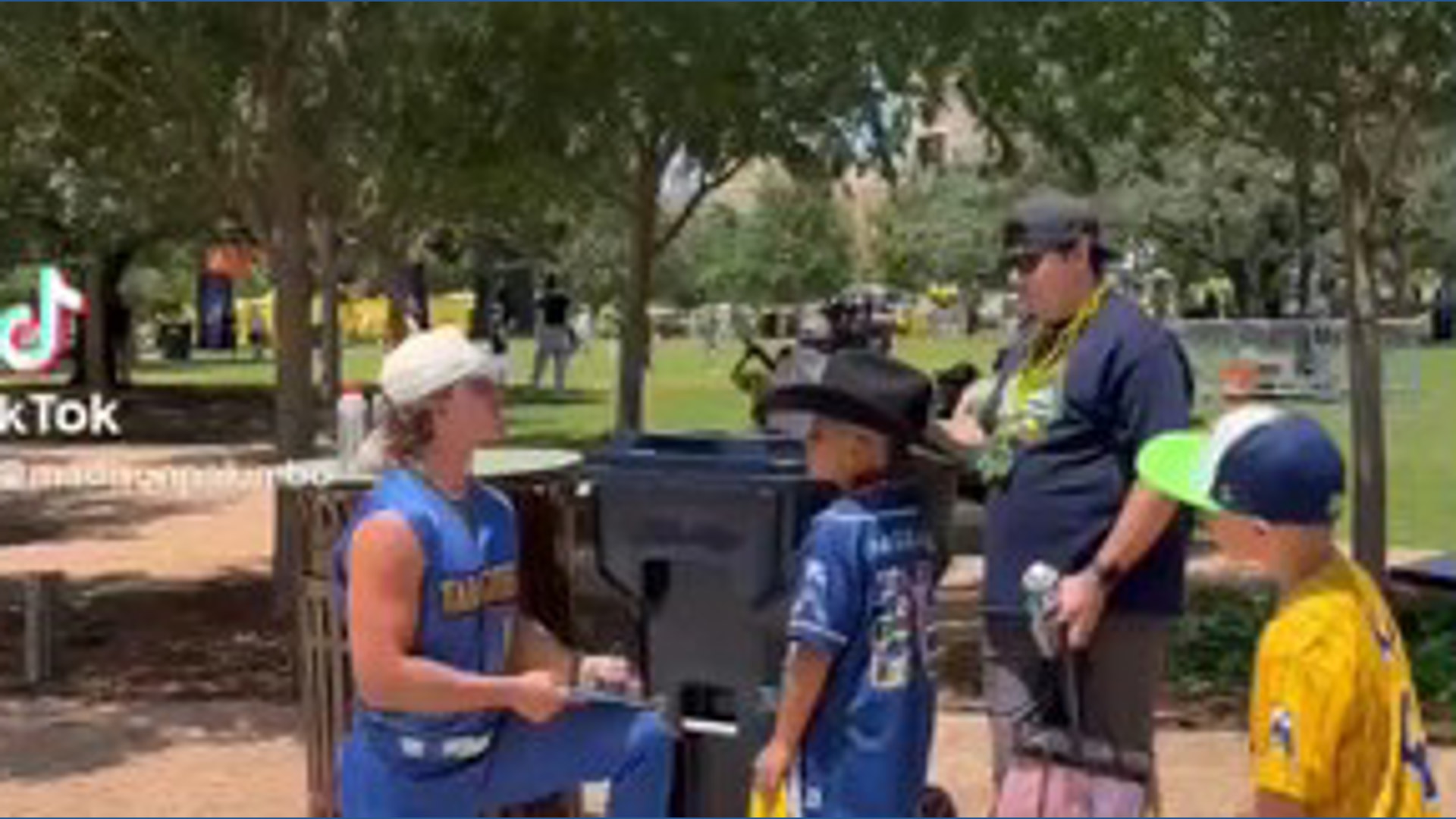 Texas tailgaters greet kids and sign autographs