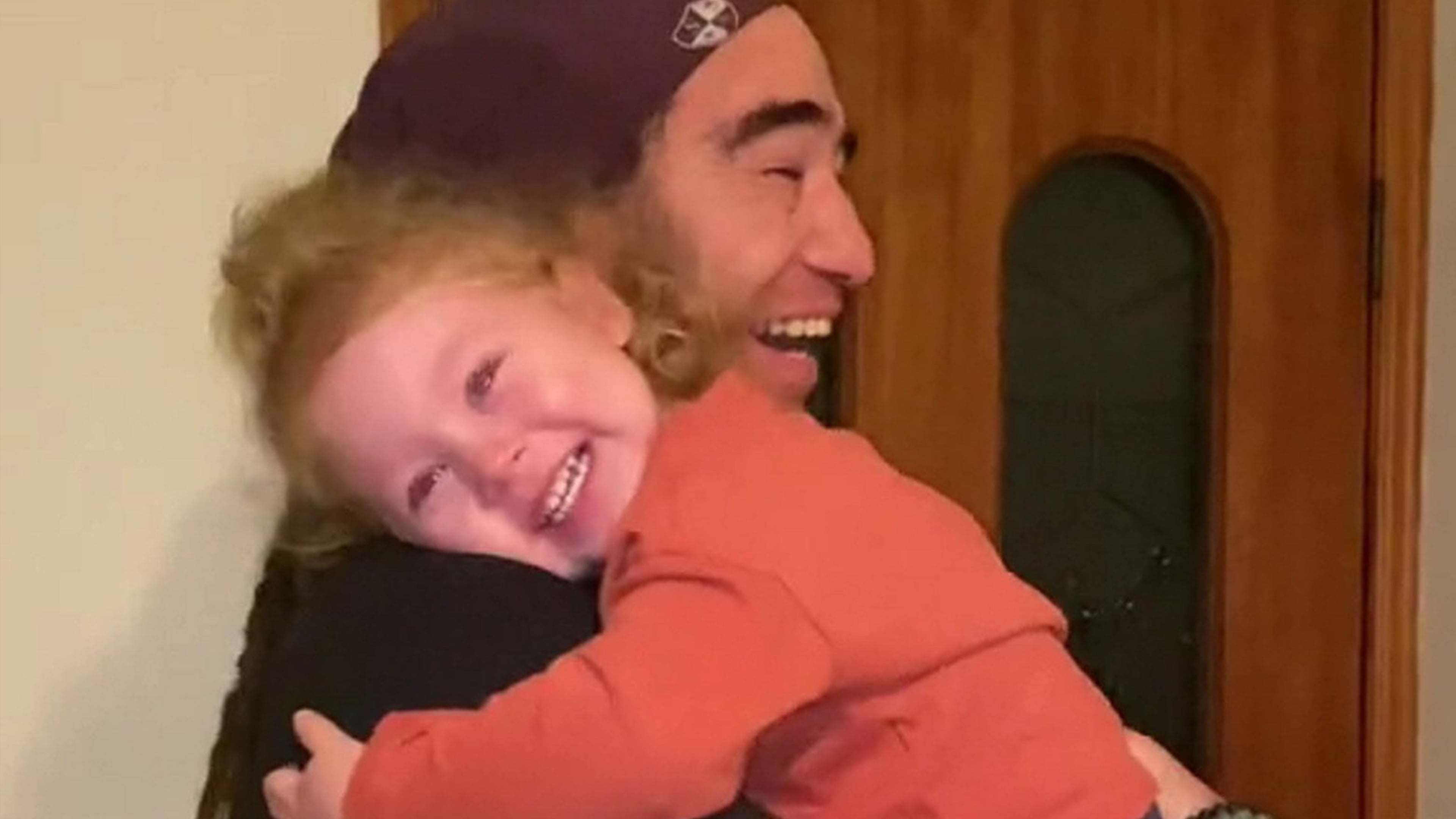 Emotional moment child is reunited with dad after three months apart