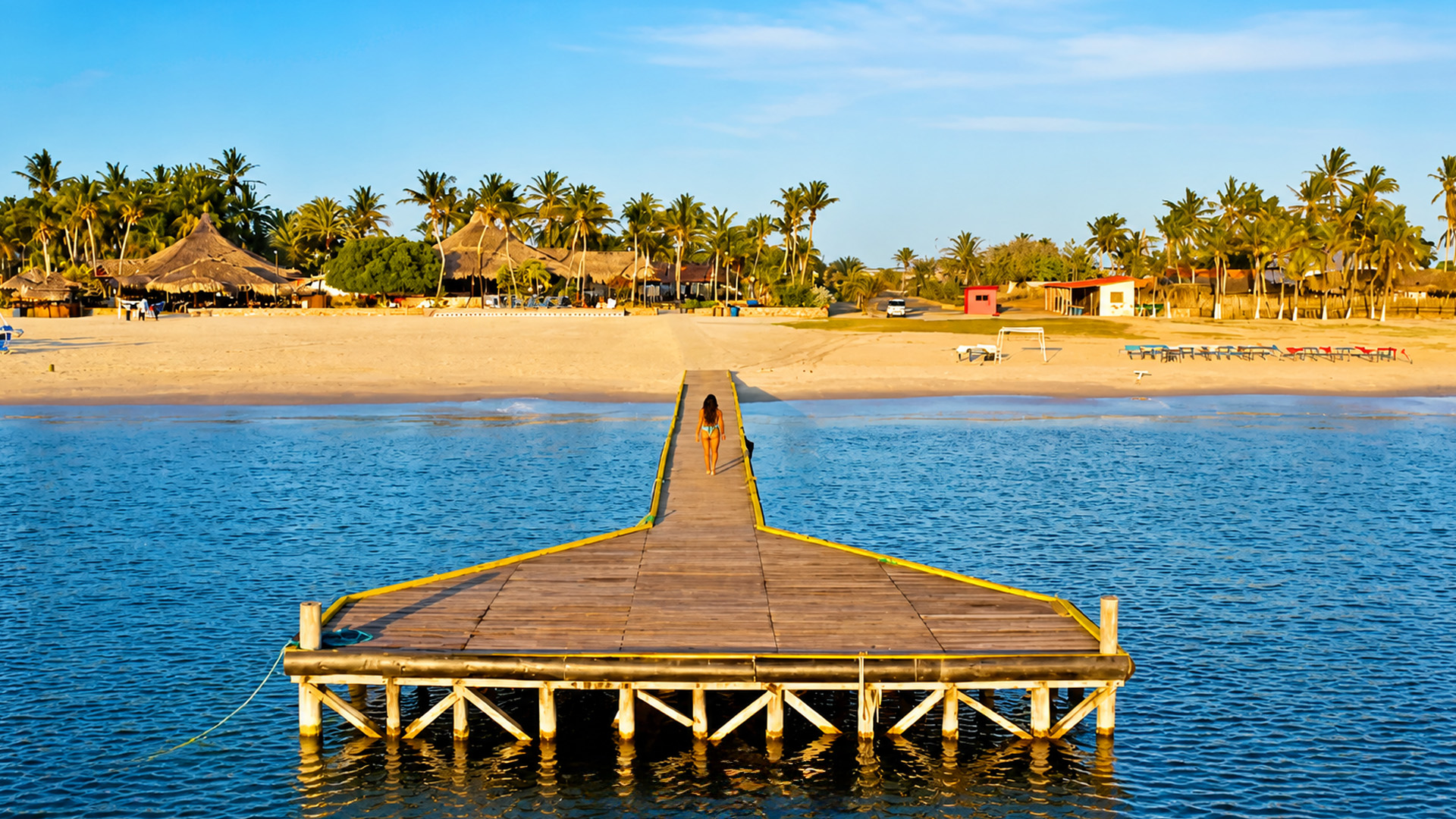 A hidden tropical island with a pier stretching into the sea