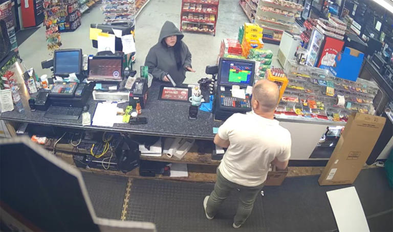 Wild video shows woman shoot gun at gas-station clerk: 'Oh, my God!'