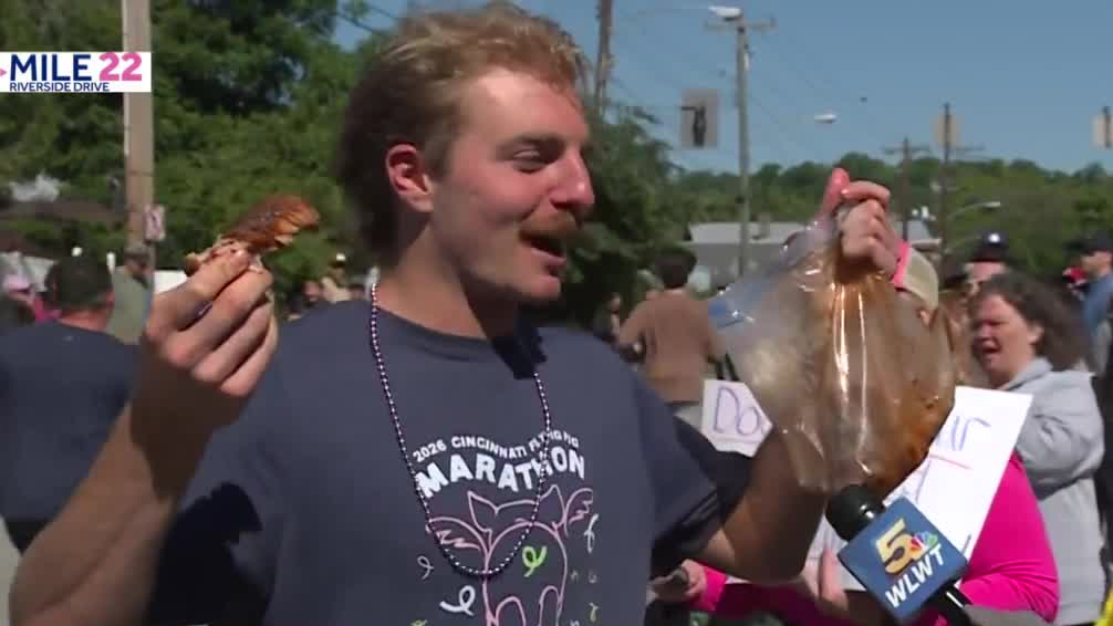 Flying Pig marathon runner eating rack of ribs while on the course ...