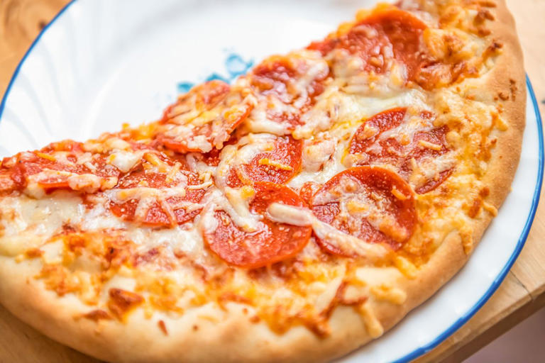 The only way you should reheat pizza, according to the pizza expert