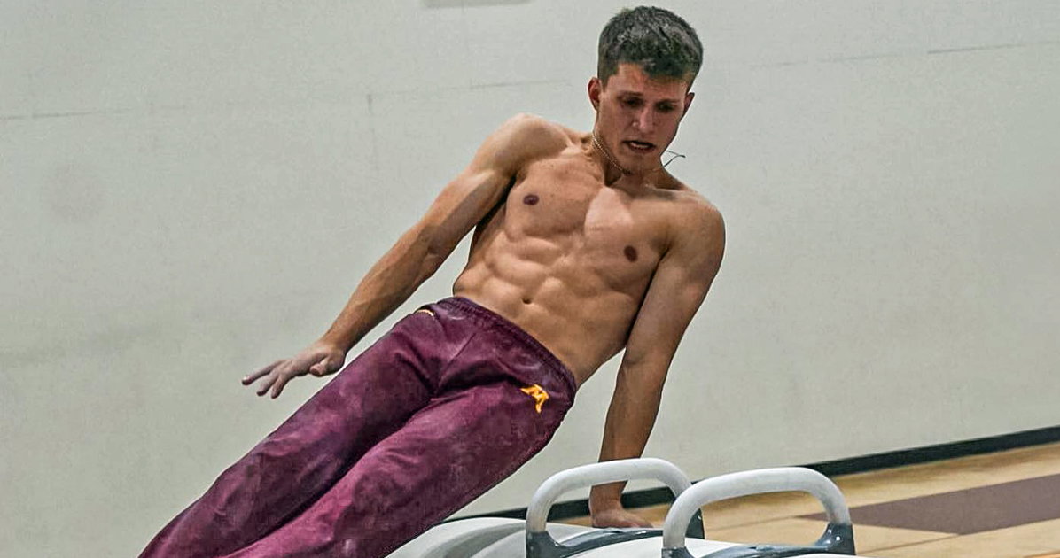 Gay college gymnast shines in leading team to conference title