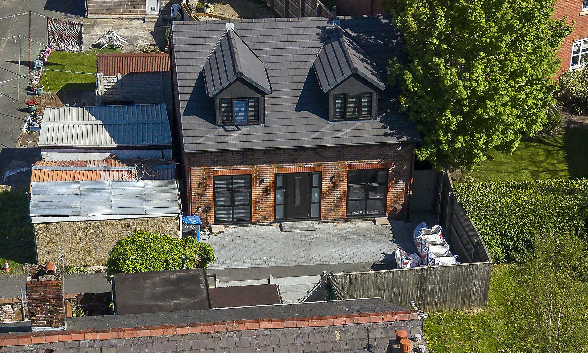 Businessman who built a £200,000 'house' in his garden will 'not pay a ...