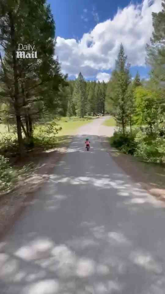Father calmly guides daughter through bike ride scare