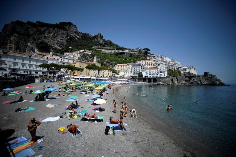 Hordes of tourists seeking cheap travel are trapping villagers inside ...