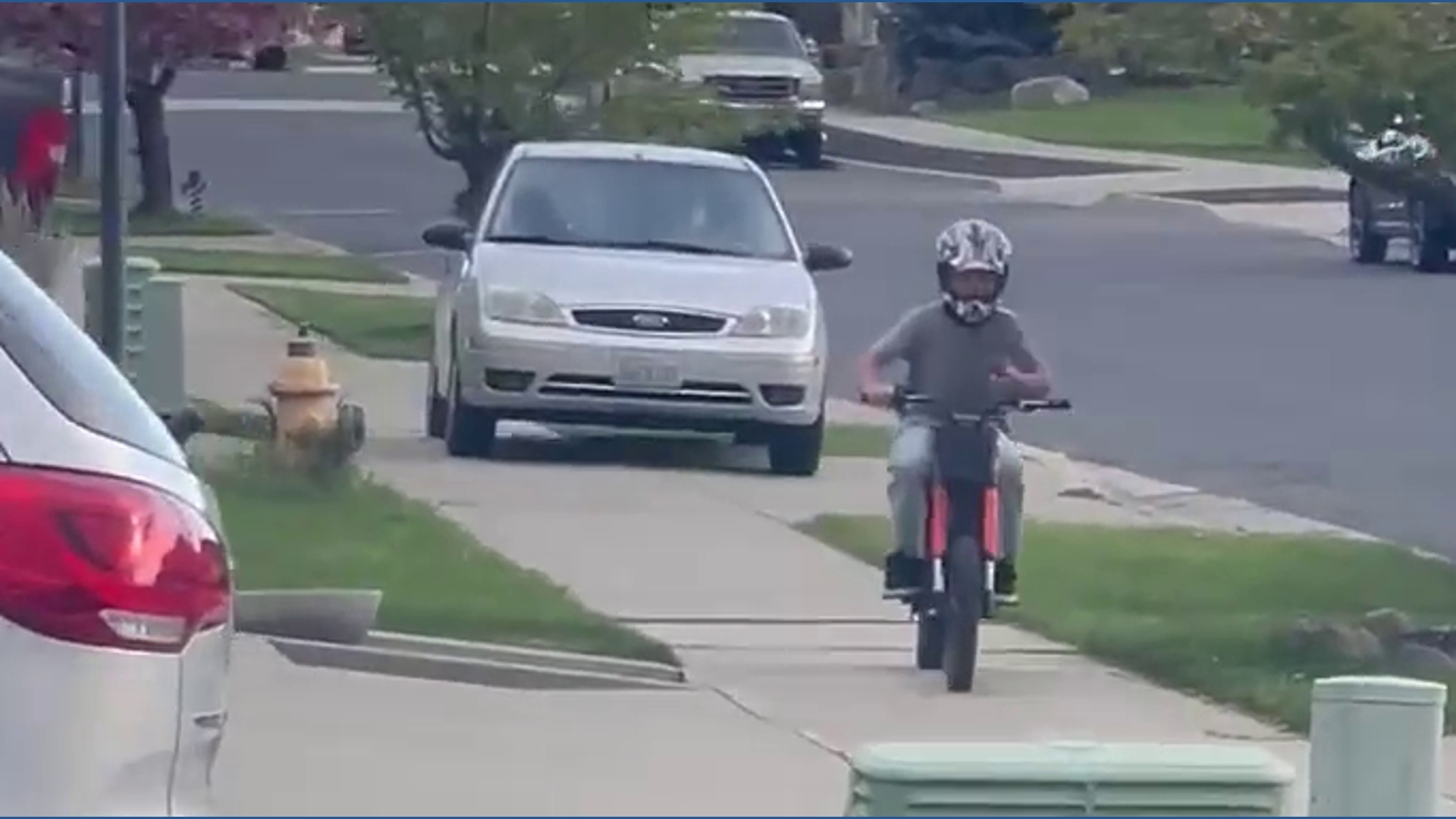 Driver hops curb to chase child dirt bike rider in Spokane County