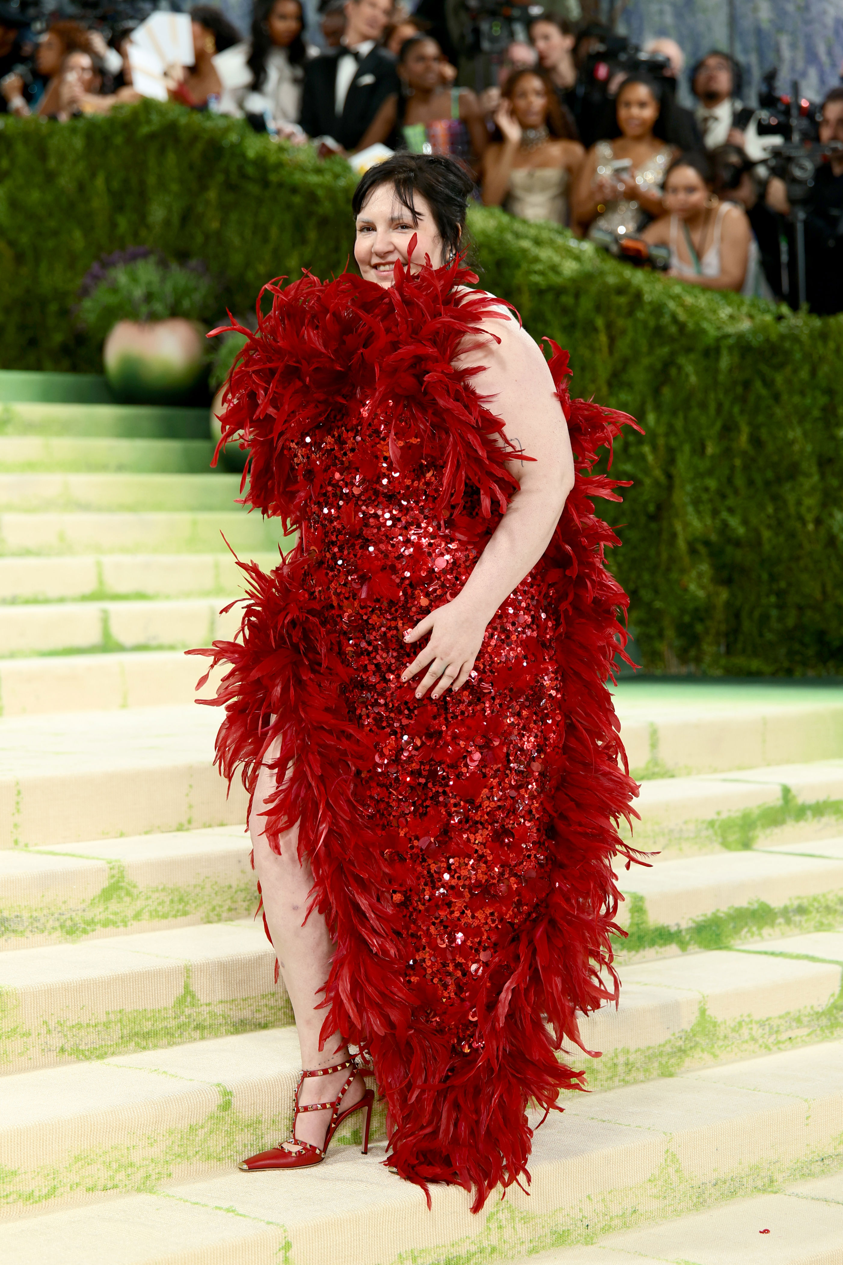 Lena Dunham goes full showgirl in red feathers and sequins on Met Gala ...