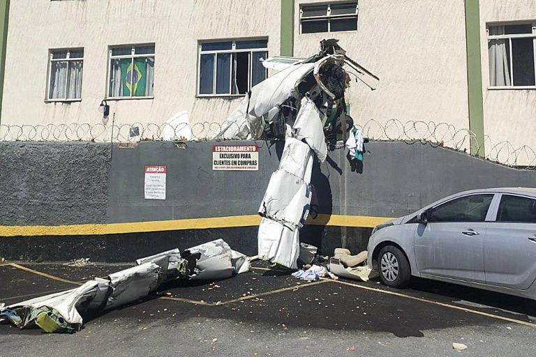 Moment plane crashes into building in Brazil city centre killing two people
