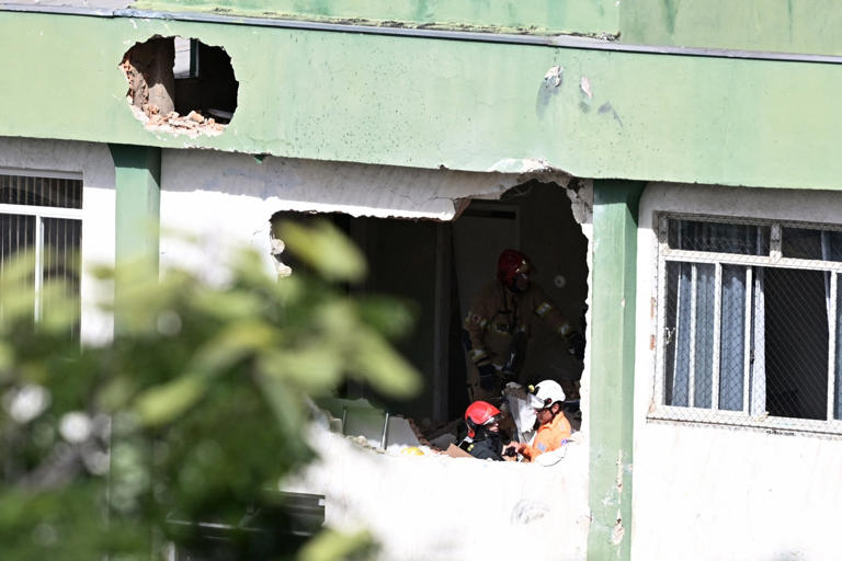 Moment plane crashes into building in Brazil city centre killing two people