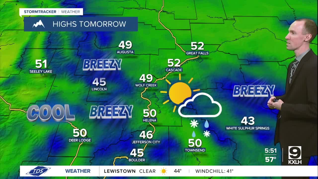 Cool and breezy with a few rain/snow showers on Tuesday
