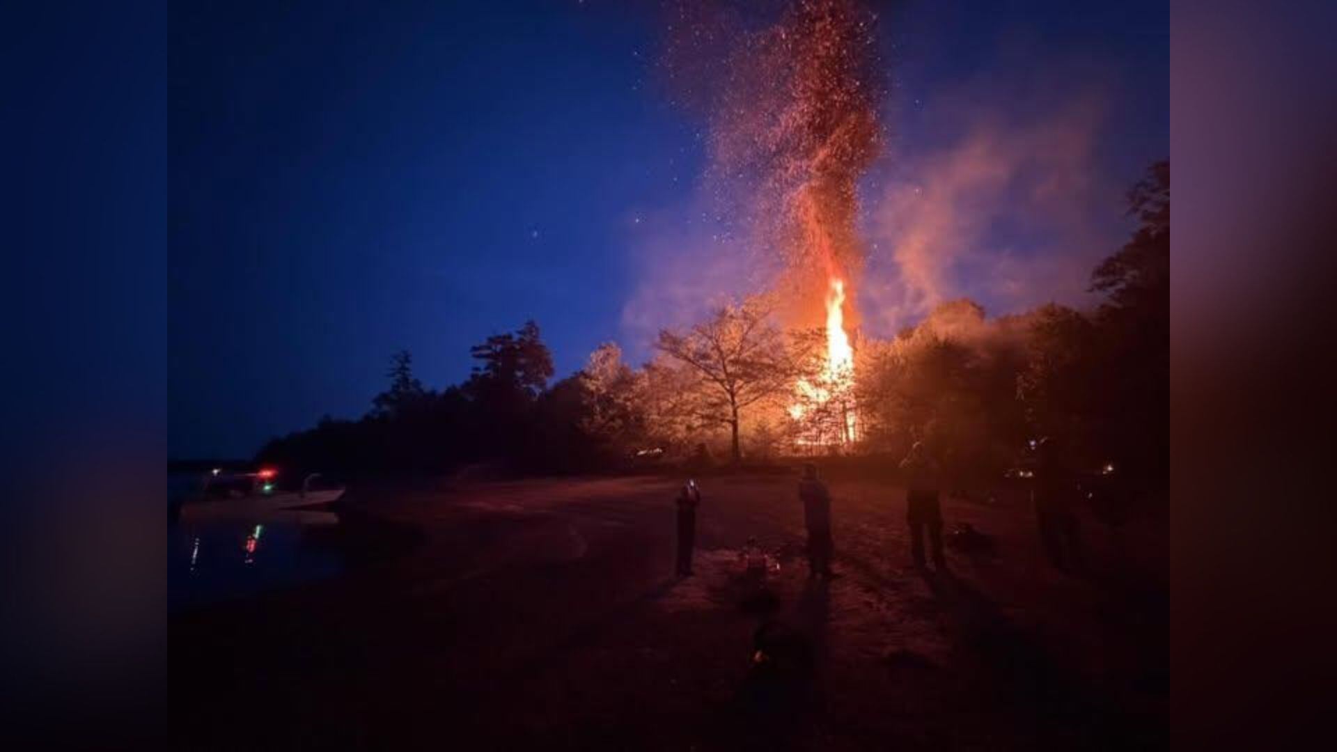 Crews working to contain wildfire on island in Lake Hartwell, officials say