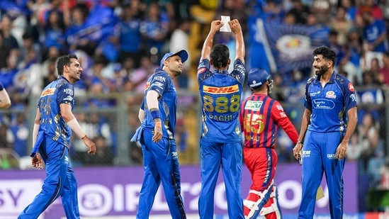 MI’s Raghu Sharma takes out chit after picking up maiden IPL wicket ...
