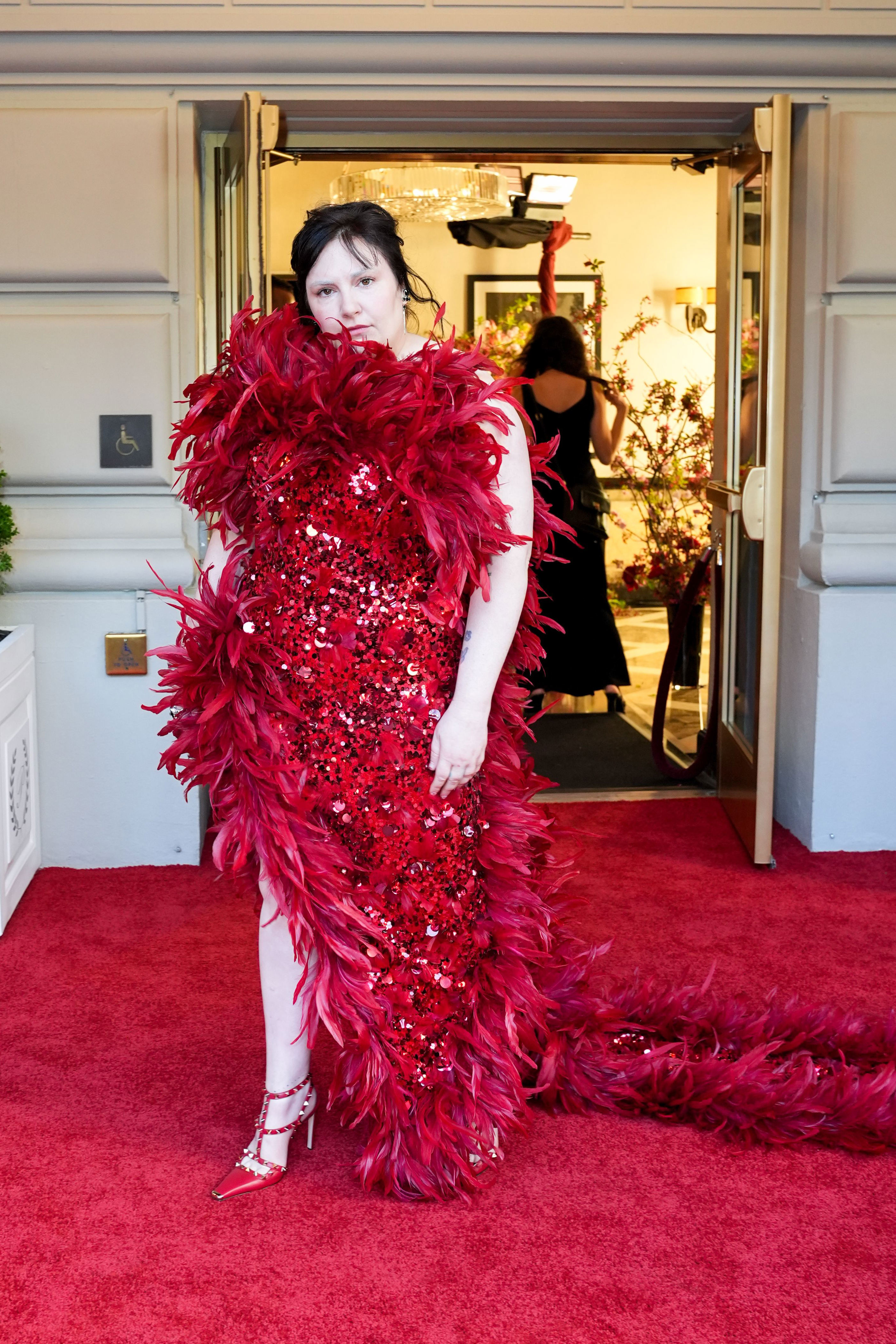 Lena Dunham goes full showgirl in red feathers and sequins on Met Gala ...
