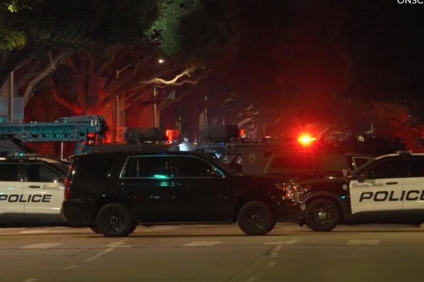 Uber driver accused of attempted murder of officer, holding woman ...