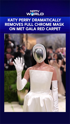 Katy Perry dramatically removes full chrome mask to reveal her face on ...
