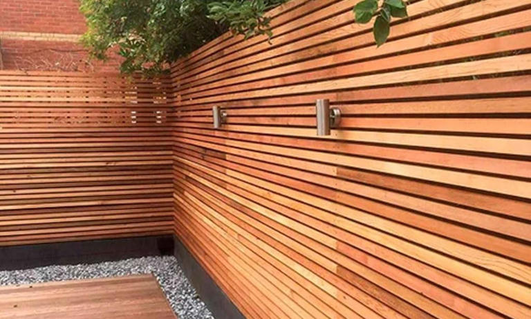 What your fence says about you, including why grey paint screams bad taste
