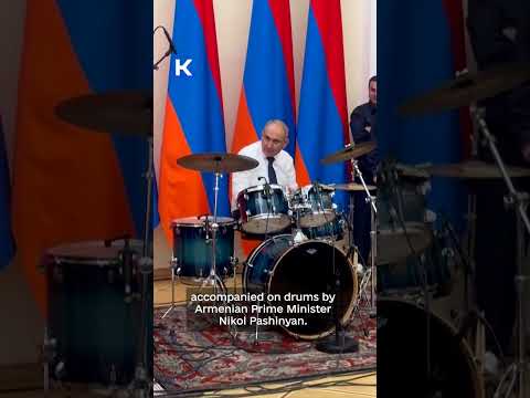 Emmanuel Macron and Nikol Pashinyan perform together during an official ...