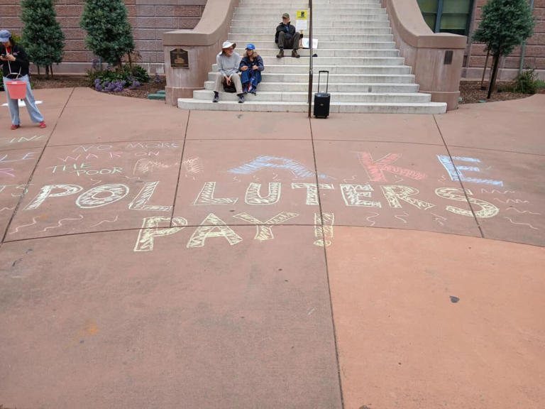 Protesters gather for May Day rally at City Hall