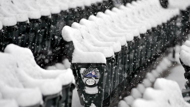 Colorado Rockies reschedule games as spring storm brings snow to Denver