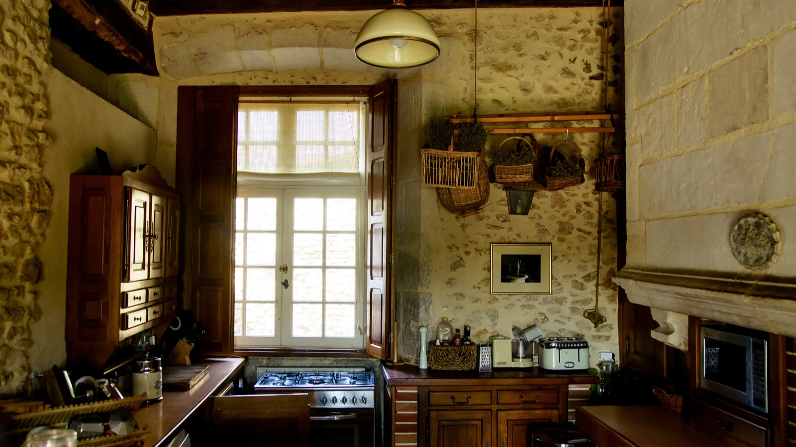 Tuscan kitchen style is making a quiet return and looks nothing like before