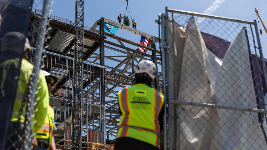 Charlotte Hornets broadcaster Sam Farber speaks at the topping off ...