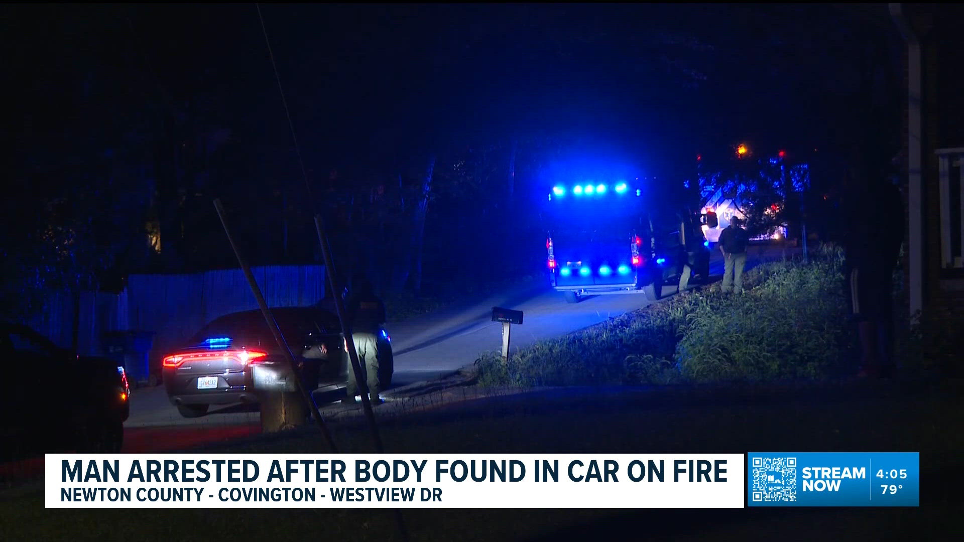1 in custody after body found in burning car