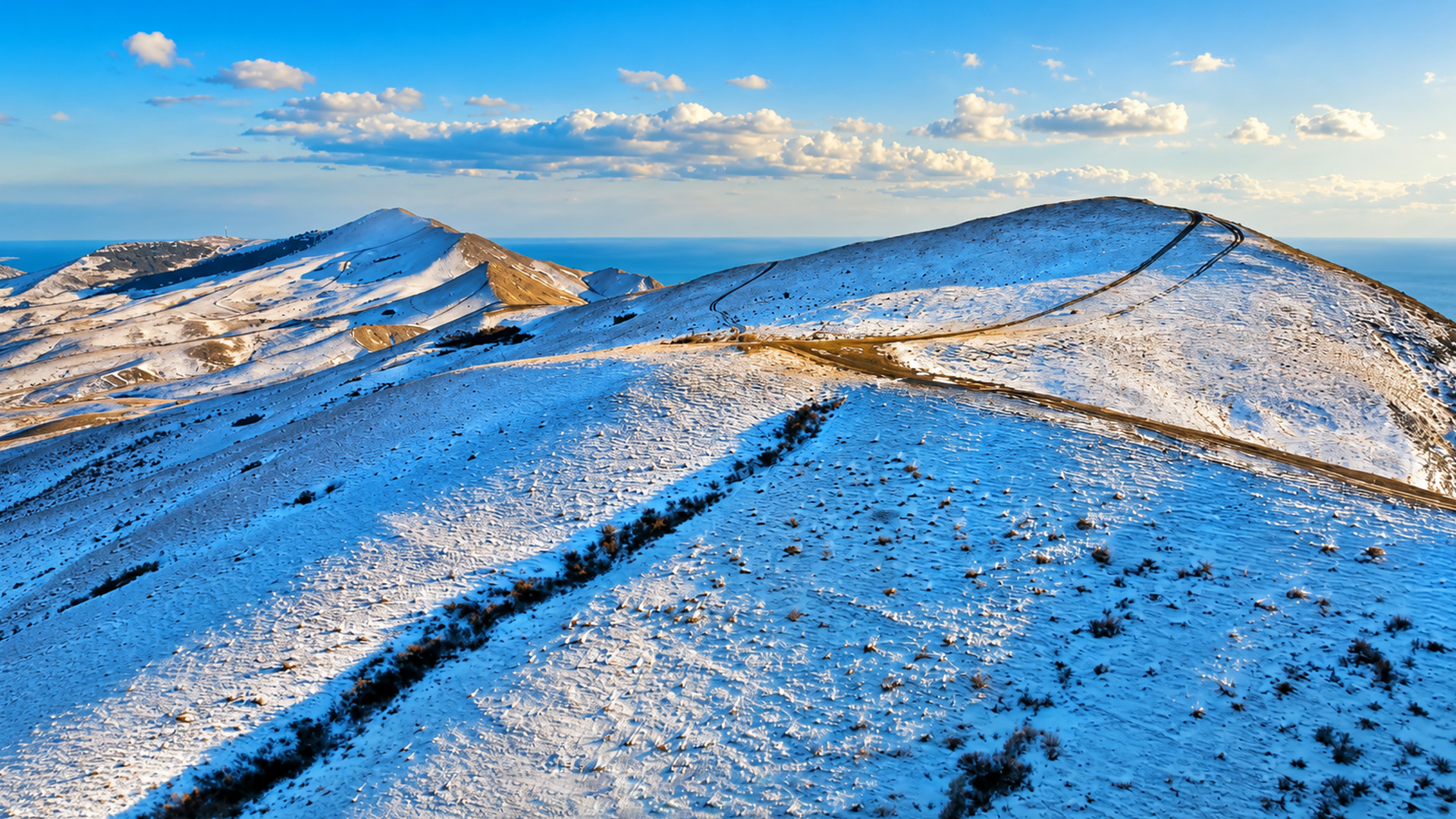 A vast mountain range covered in snow across South America