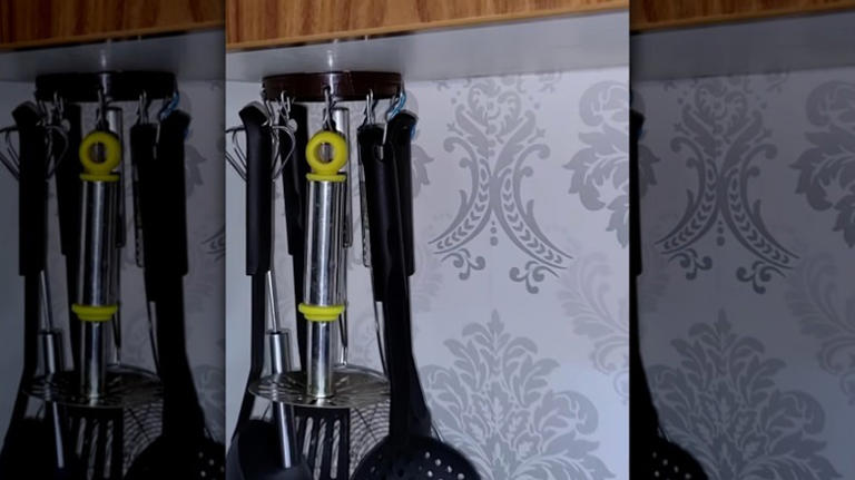 Turn a plastic lid into a clever kitchen utensil storage solution