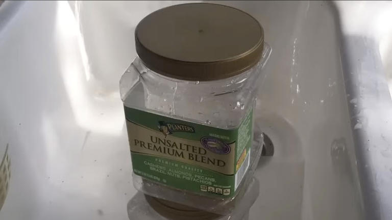 Turn a plastic lid into a clever kitchen utensil storage solution