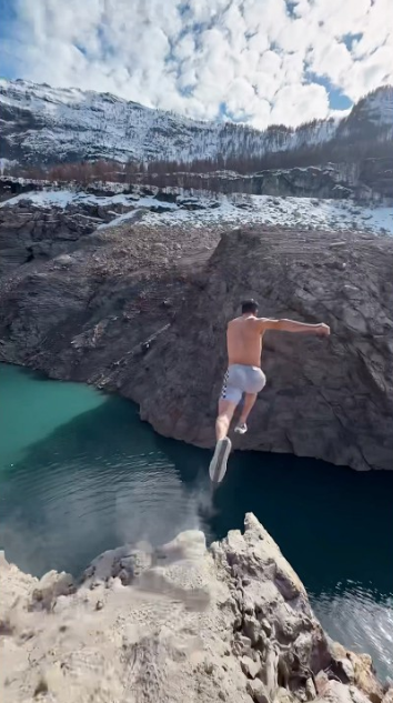 POV cliff jump into freezing water captured on camera