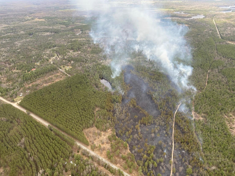 Oscoda County fire still burning, under investigation