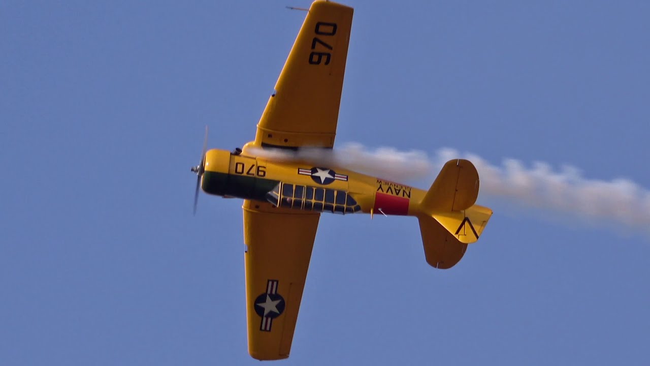 Watch this T-6 fill the sky with smoke - "It twists like a WWII dogfight"
