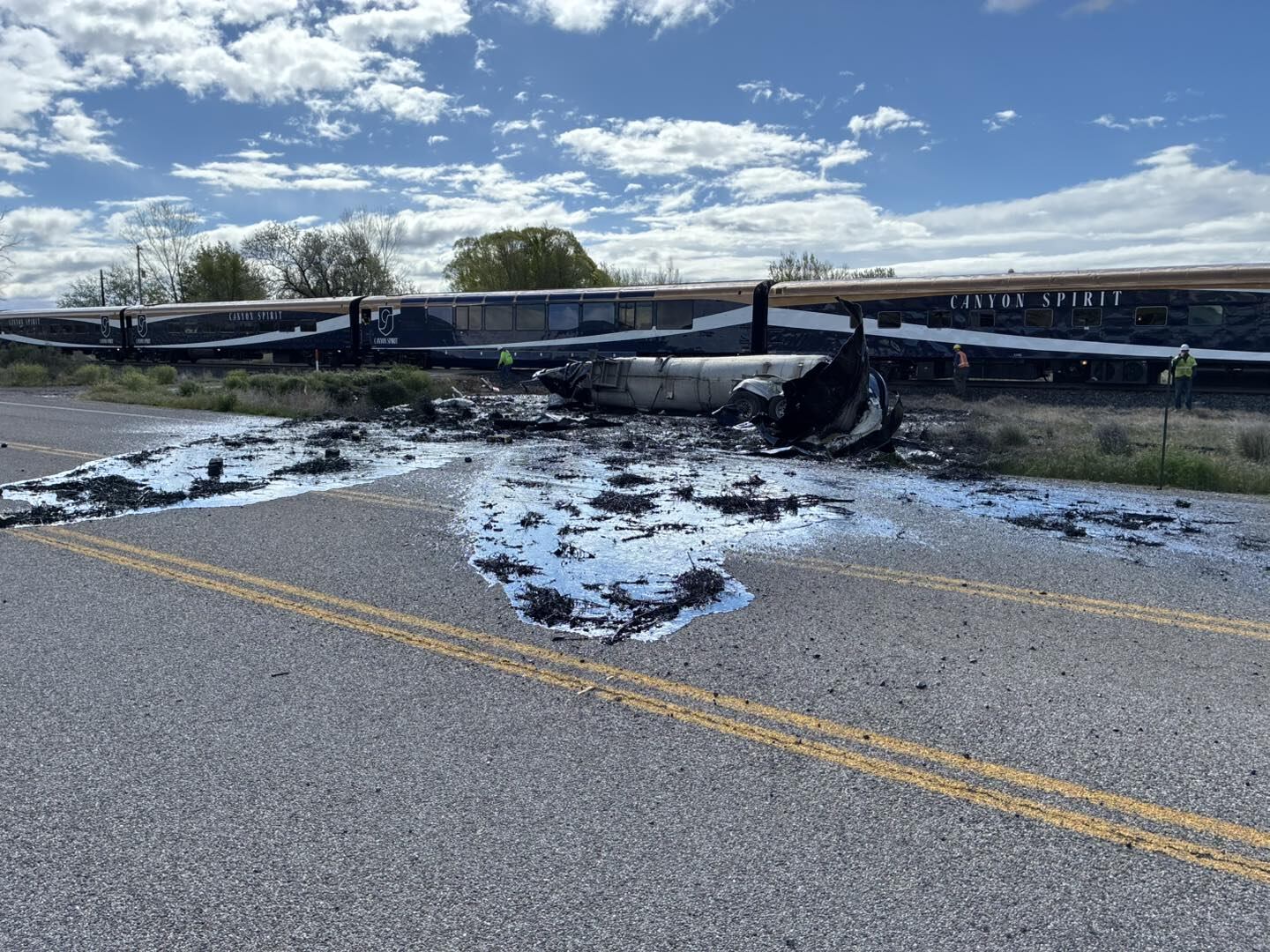 Tanker truck was split open by passenger train, spilling 6,000 gallons ...
