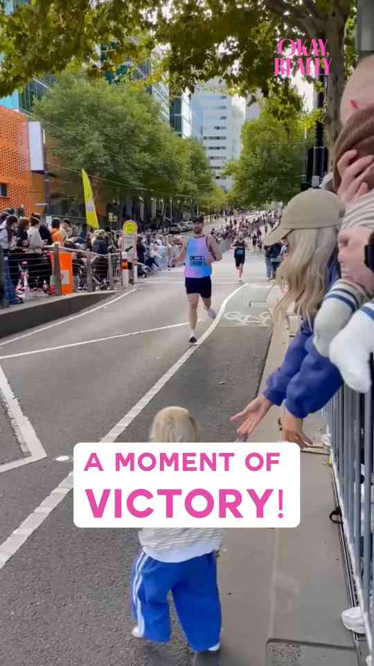 Husband carrying kids over finish line