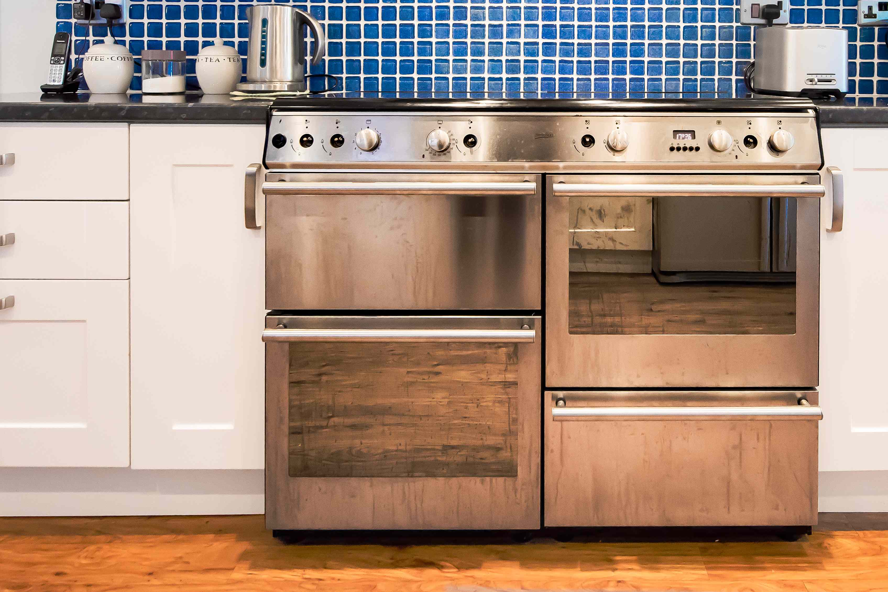 How to clean under your stove without moving it an inch