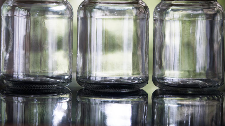 Turn an old pickle jar into a stunning hanging lantern for your porch