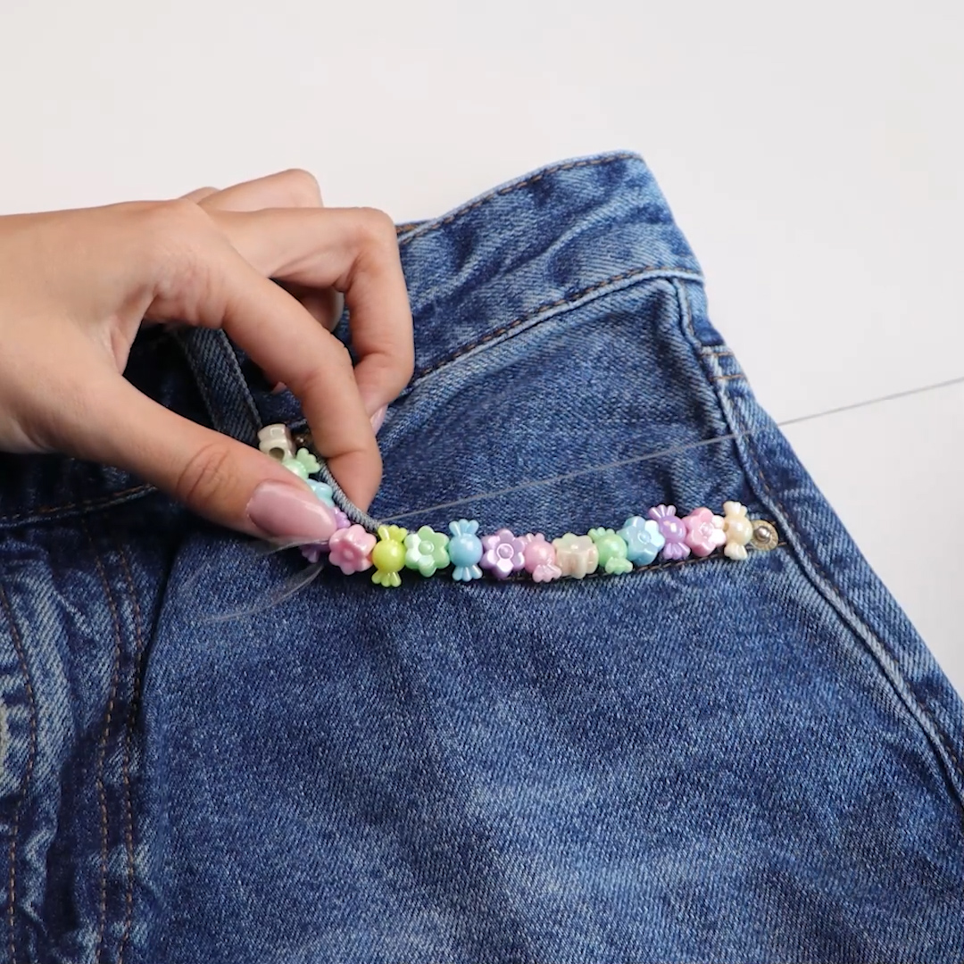 Embroidering beads to your jeans is the new trend💓