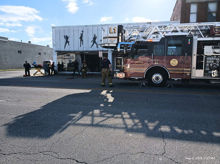 Car crashes into Joplin Main Street building, two injured
