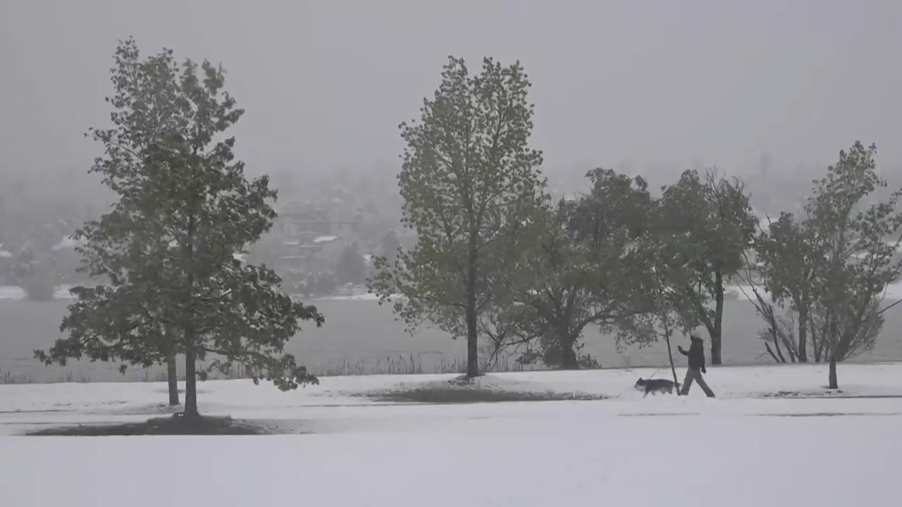 Denver families dust off winter gear for spring snowstorm